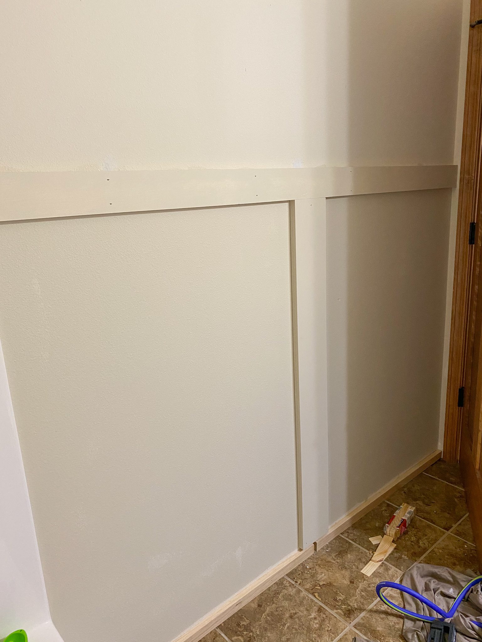 How to Make a Beautiful Vertical Shiplap Half Wall - The Handcrafted Haven